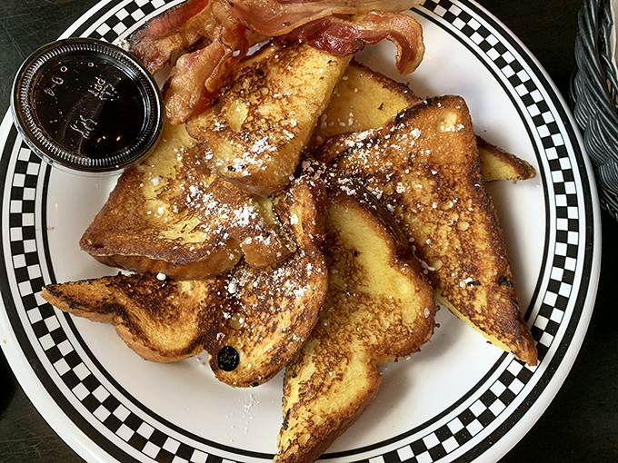 French toast that would make your grandmother jealous, dusted with powdered sugar and served with a side of nostalgia.