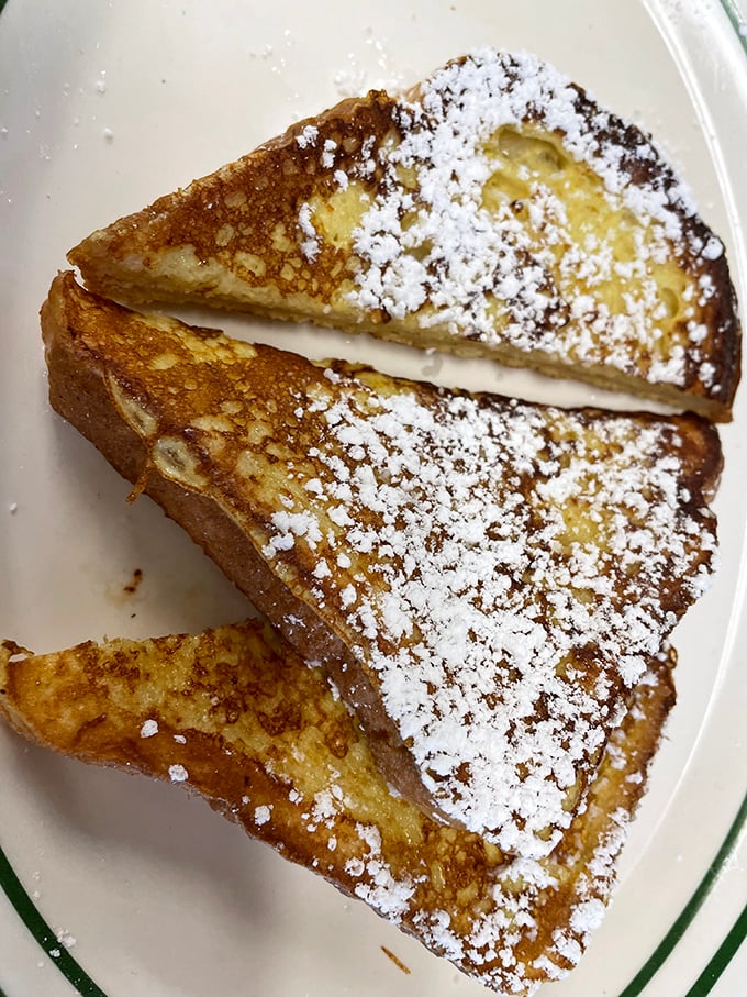 French toast that's dressed for success with a snowfall of powdered sugar. Breakfast or dessert? At places like this, the line deliciously blurs.