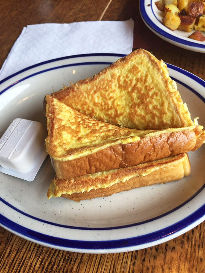 Golden-brown French toast that's achieved that perfect crispy-outside, custardy-inside balance. Breakfast engineering at its finest.