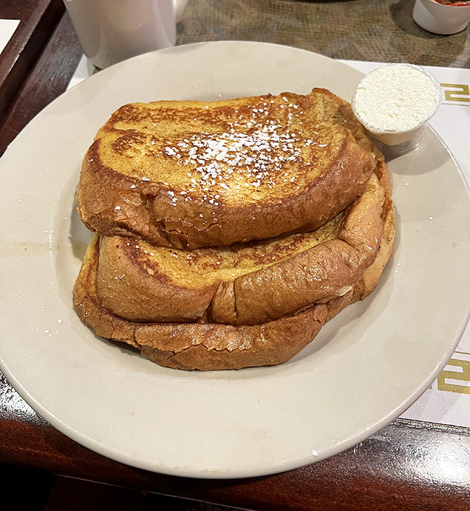 French toast that's been properly introduced to cinnamon and powdered sugar&mdash;a breakfast that doesn't know it's not dessert. 