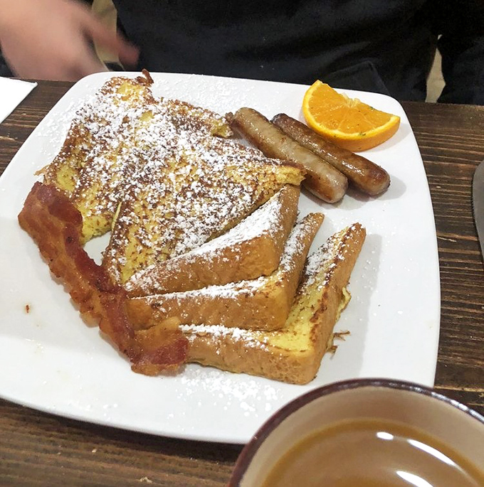 French toast that's dressed for success with powdered sugar and a side of sausage&mdash;breakfast's version of formal wear.