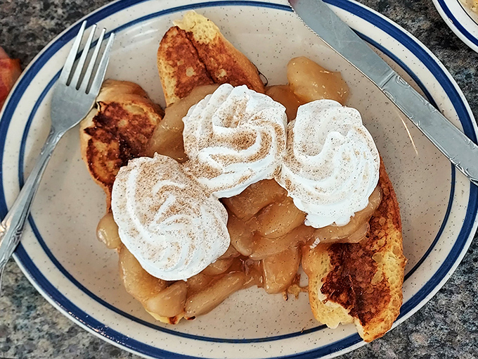 Apple French toast that makes you question why you ever settled for the regular version &ndash; topped with whipped cream rosettes that mean business.