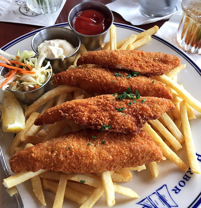 Perfectly golden fish and chips that would make a British pub jealous. The crunch you hear when cutting into that crust is nature's applause.