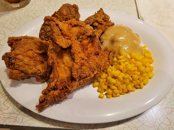 Fried chicken so golden it could fund your retirement. Paired with corn that's sweeter than the sock hop memories this place conjures up.