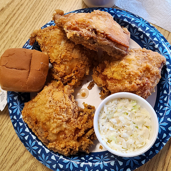 Fried chicken so perfectly golden it deserves its own Instagram account. Paired with creamy coleslaw and a dinner roll, it's the comfort food trifecta we all need.