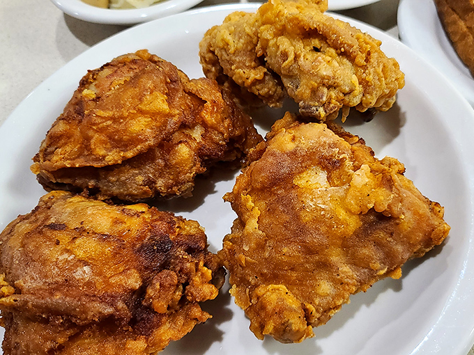 Golden-brown fried chicken that crackles with each bite, revealing juicy meat beneath&mdash;Colonel Sanders would hang up his white suit in defeat.
