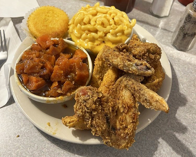 Fried chicken, mac and cheese, and candied sweet potatoes - the holy trinity of comfort that makes Monday feel like Saturday.