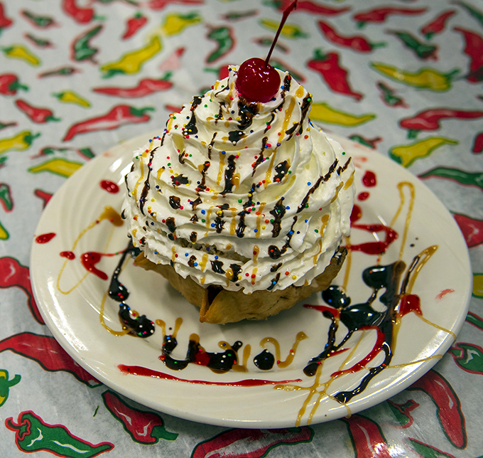 This isn't just dessert; it's a celebration tower of fried ice cream with enough whipped cream to make your inner child high-five your adult self.