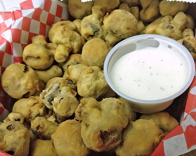 Fried mushrooms that achieve the impossible: golden, crispy exteriors giving way to juicy centers. The ranch dipping sauce is merely a bonus.