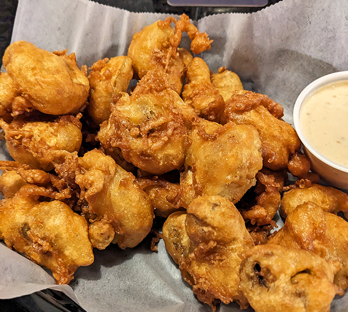 These golden-battered mushrooms aren't just fried &ndash; they're transformed into crispy vessels of earthy goodness that would make even vegetable skeptics reconsider.