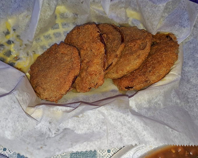 Fried pickles: proof that anything becomes magical when properly battered and fried. These crispy discs are the unsung heroes of Southern appetizers.