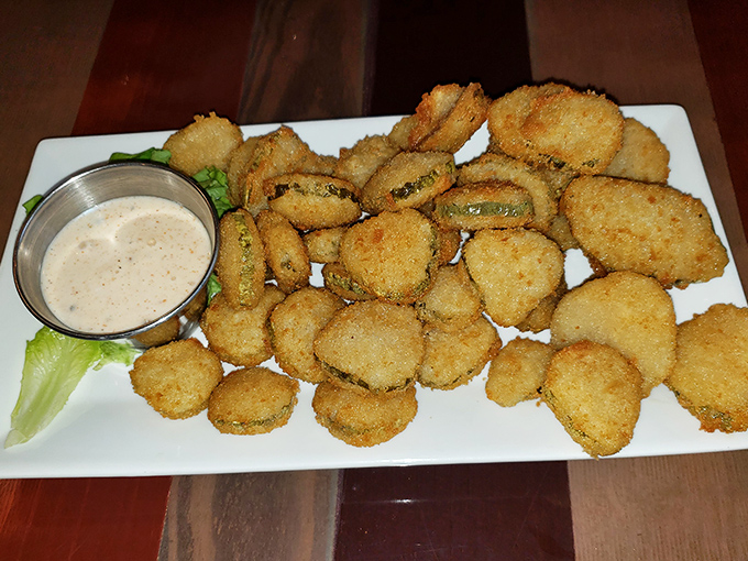 Fried pickles: proof that anything becomes magical when breaded and introduced to hot oil. That dipping sauce isn't just a condiment—it's a flavor wingman.