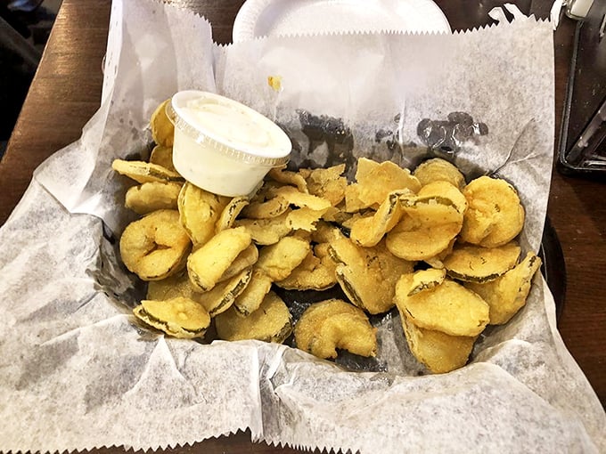 Golden-fried pickle chips that snap between your teeth like edible poker chips. The dipping sauce is just showing off at this point.