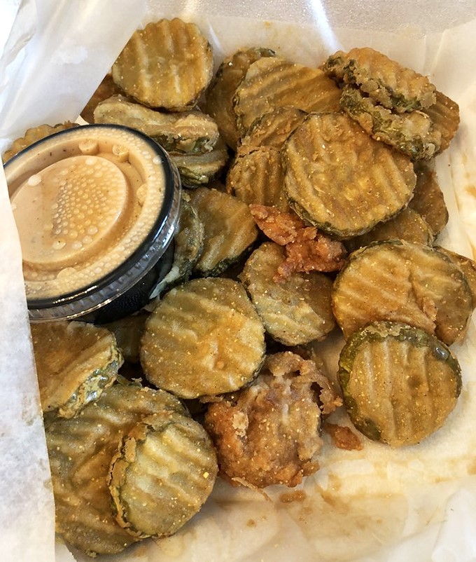 Golden-fried pickle chips that disappear faster than your willpower at a barbecue joint.