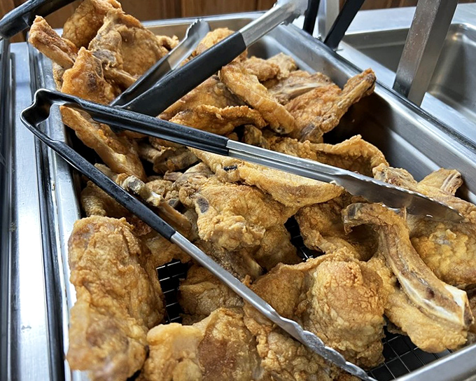 Golden-fried pork chops that shatter with each bite, revealing juicy meat that puts fancy steakhouses to shame.