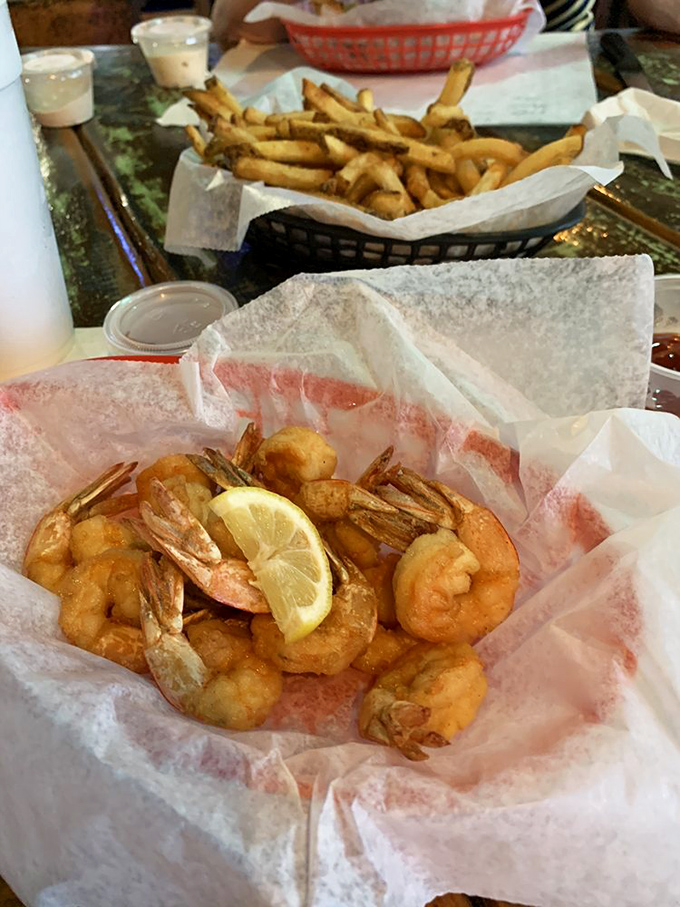 These golden-fried shrimp aren't just food; they're little treasures from the sea, crispy on the outside, sweet within.