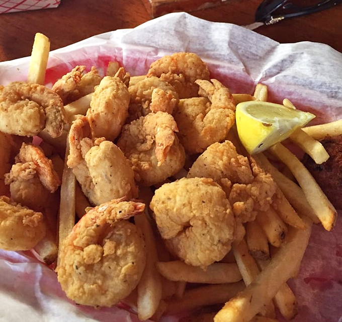 Golden-fried shrimp nestled among crispy fries &ndash; the kind of basket that makes you forget you ever knew the word "cholesterol."