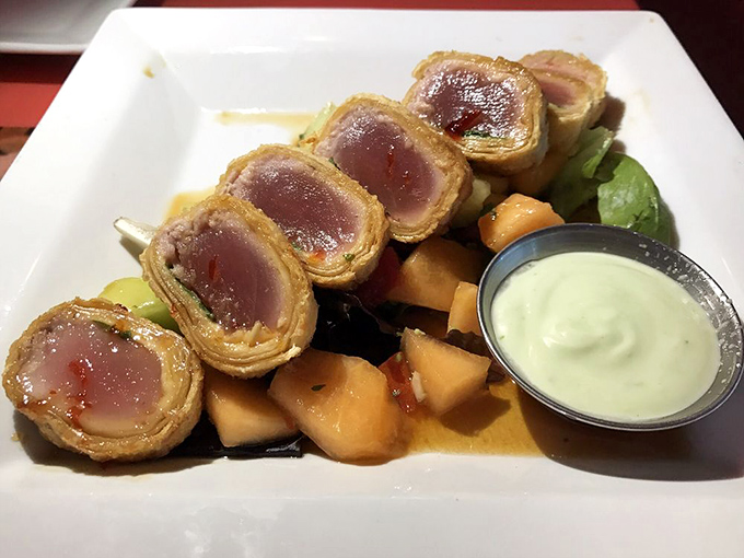 The Tuna Basil Roll&mdash;seared perfection wrapped in crispy goodness. Rare in the center, like finding humility in Hollywood.