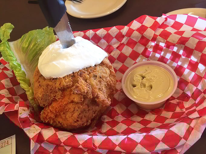 The fried avocado arrives like a crispy golden orb of Texas ingenuity. Whoever first decided to batter and fry nature's butter deserves a monument.