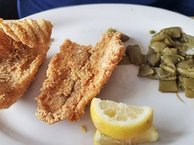 Crispy catfish that would make Mark Twain weep with joy, served with green beans that actually taste like they've seen a garden.