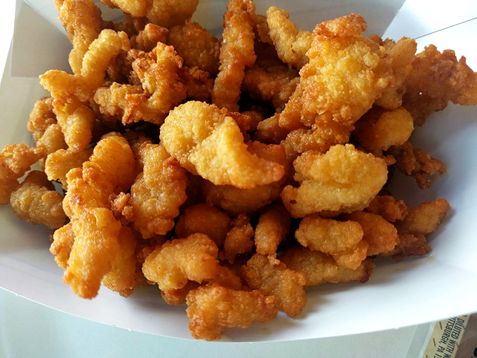 These golden nuggets of fried clam goodness could make Neptune himself abandon his trident for a plastic fork. Simple, unpretentious, and utterly irresistible.