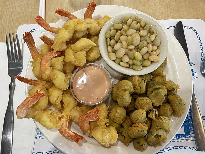 The holy trinity of Southern comfort: golden fried shrimp, crispy okra, and butter peas. A plate that whispers, "Slow down, sugar, and savor every bite."