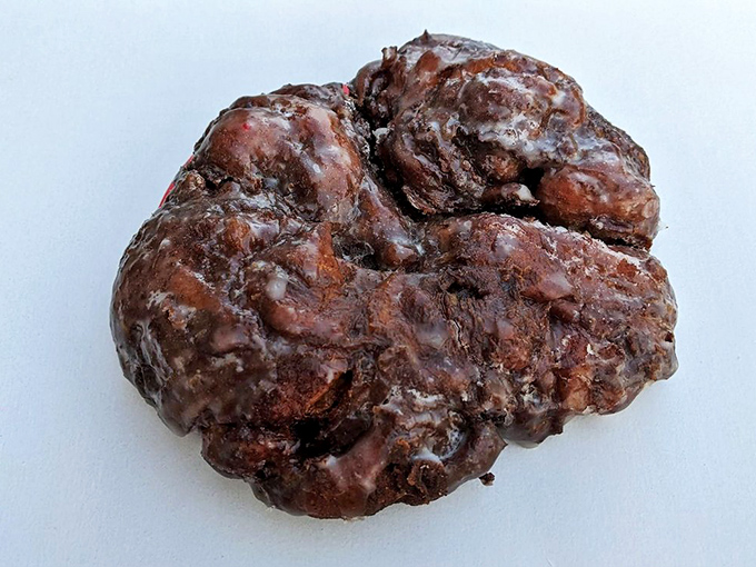 The apple fritter that launched a thousand cravings. Crispy, caramelized edges giving way to a tender, cinnamon-spiced interior – this is pastry perfection.