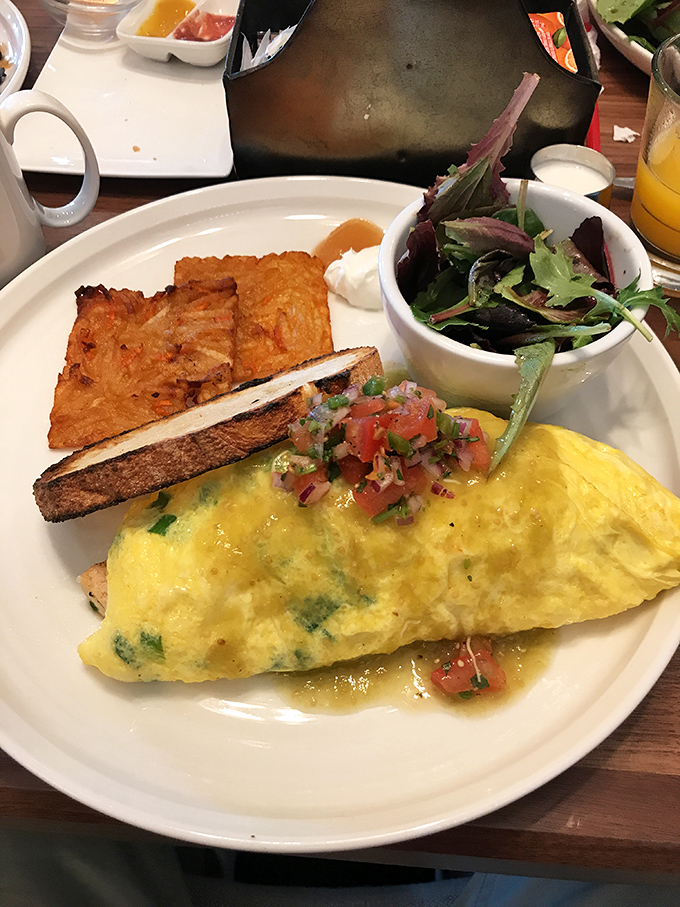 A fluffy omelet that practically floats above the plate, accompanied by toast that's achieved that elusive perfect shade of golden-brown.