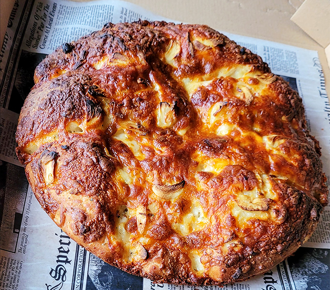 Garlic knots with a golden-brown exterior that would make Paul Hollywood weep with joy. Carb heaven has never looked so inviting.