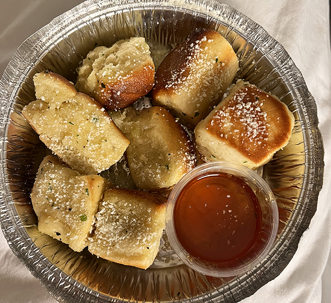 These garlic pillows dusted with parmesan are what carb dreams are made of—little clouds of heaven with honey for dipping.