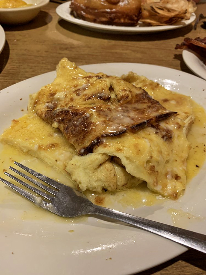 The German pancake arrives like a puffy, golden cloud that's somehow landed on your plate. One squeeze of lemon and it deflates with theatrical flair.
