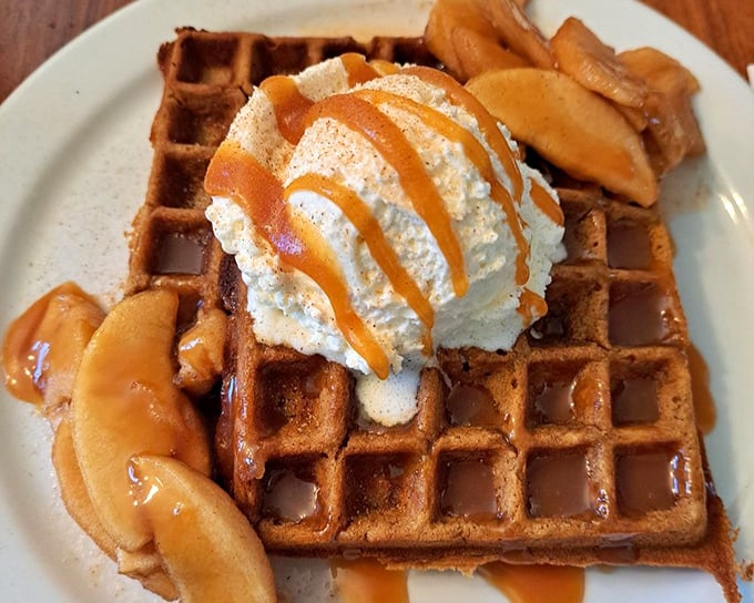 This vanilla bean waffle topped with caramel sauce and seasonal fruit isn't just breakfast&mdash;it's what angels eat when no one's looking. 