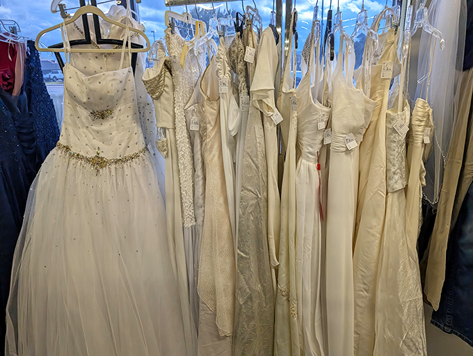 Wedding and formal gowns hang like pearly promises, offering budget-conscious brides the chance to say "I do" without the "I owe."