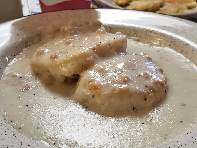 When sausage gravy meets fresh biscuits, magic happens that would make your grandmother weep tears of pure joy.