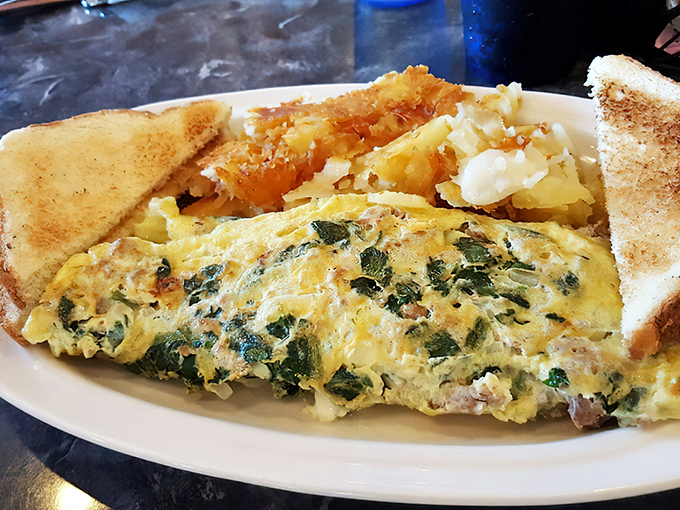 This isn't just an omelet&mdash;it's a garden party wrapped in eggs. The spinach and cheese create a breakfast symphony worthy of a standing ovation.