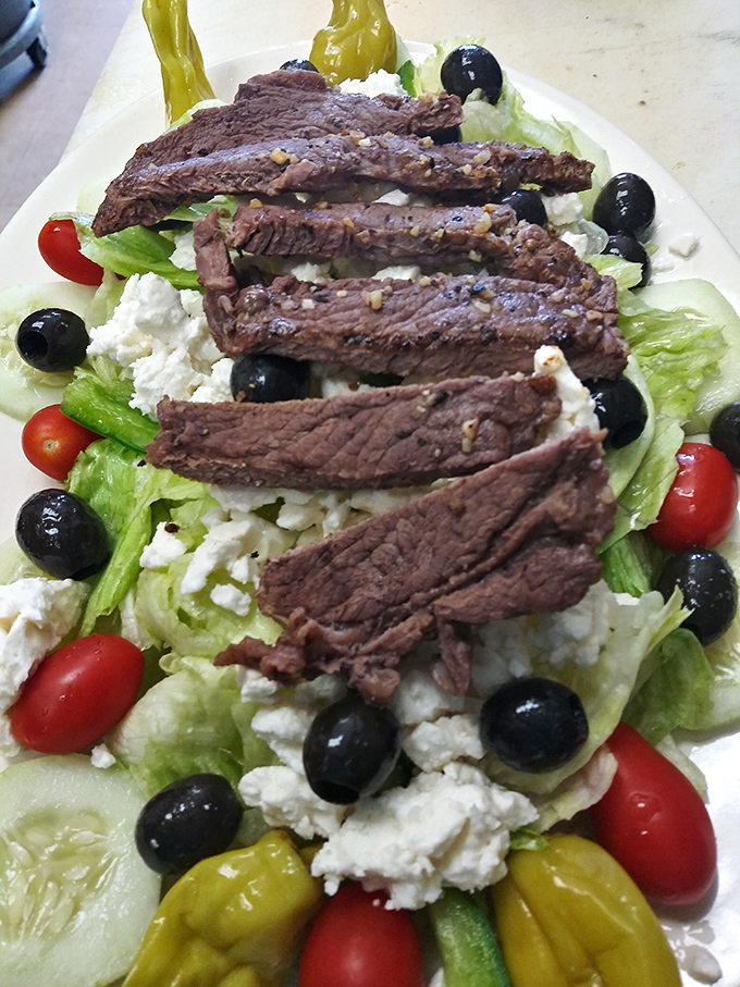 When a Greek steak salad looks this good, even dedicated carnivores might forget they're eating vegetables.