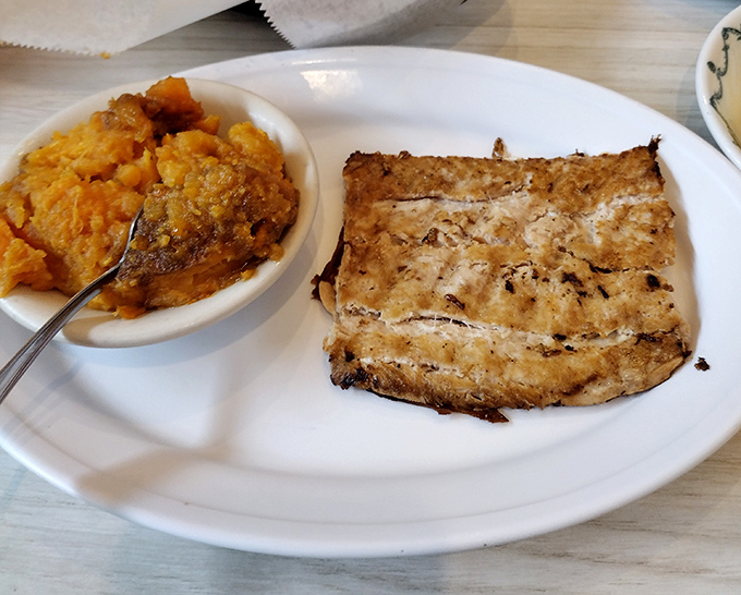 Grilled salmon meets sweet potato casserole in a delicious duet that proves this cafe isn't just about traditional Southern fare&mdash;it's about doing everything right.