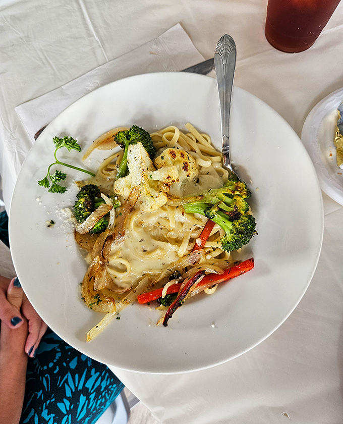 Pasta perfection that would make an Italian grandmother nod in approval &ndash; creamy fettuccine Alfredo with fresh vegetables that's worth every carb.