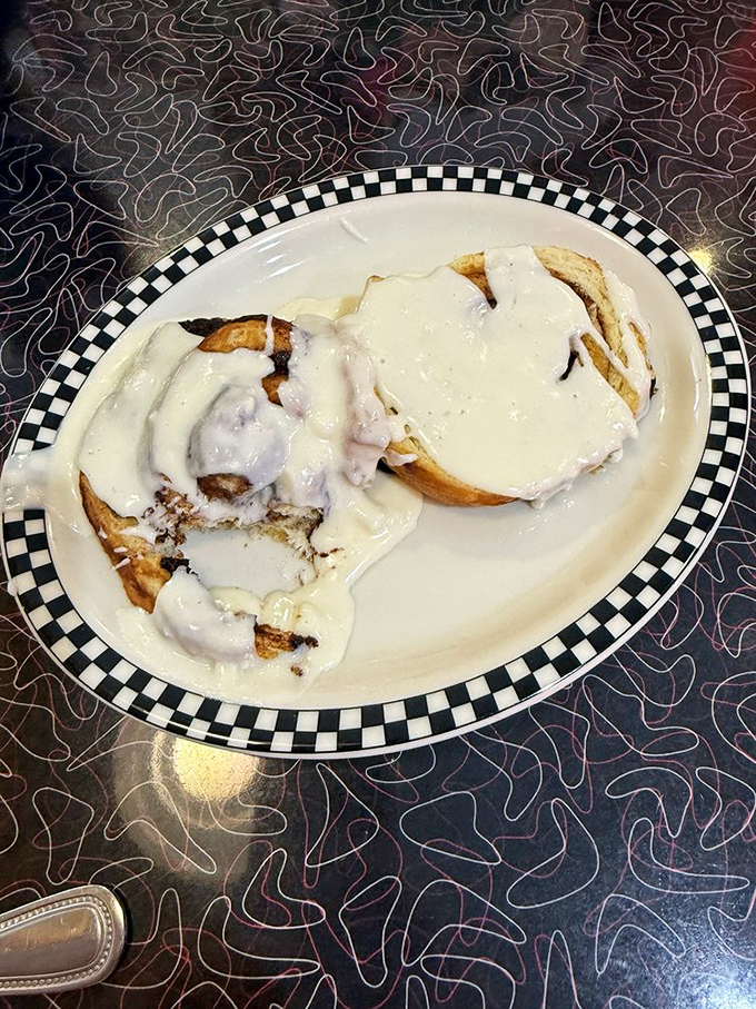 These cinnamon rolls aren't just breakfast&mdash;they're dessert masquerading as morning fuel, swimming in cream cheese icing that would make a pastry chef weep.