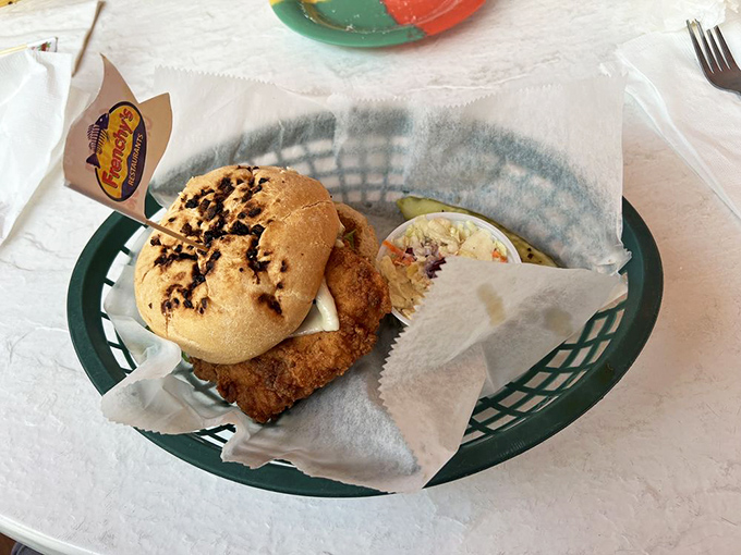 The legendary grouper sandwich&mdash;where the fish hangs over the bun like Florida real estate hanging over your budget, but infinitely more satisfying.