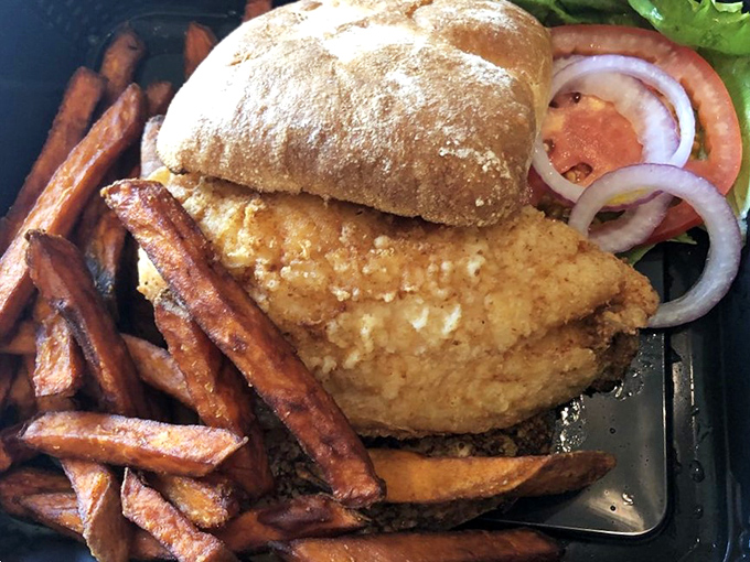 This golden-fried grouper sandwich isn't just lunch&mdash;it's Florida on a bun. Those sweet potato fries deserve their own fan club.