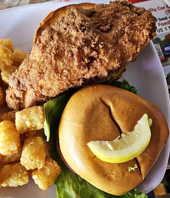 The grouper sandwich arrives golden and glorious, with tater tots that would make Napoleon Dynamite jealous.