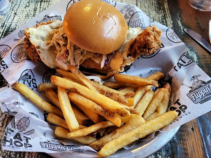 This isn't just a sandwich; it's a towering monument to freshwater indulgence with perfectly golden fries standing guard.