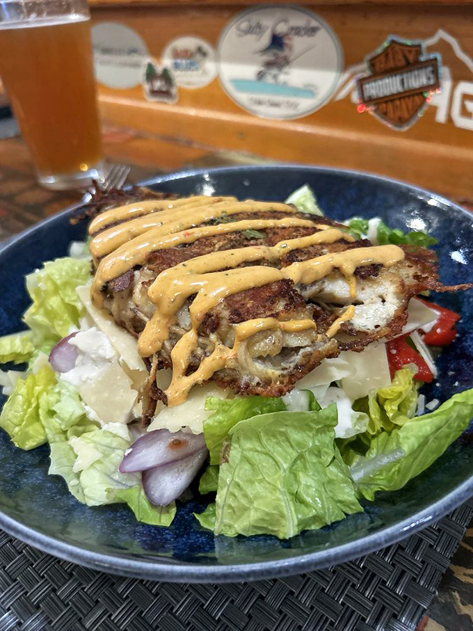 A golden-crusted fish filet drizzled with sauce that would make even the most disciplined diner lick the plate clean.