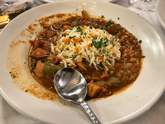 This isn't just gumbo; it's a history lesson in a bowl. Rich, dark roux cradling tender chunks of seafood and sausage with perfectly cooked rice.
