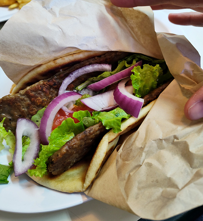 The gyro &ndash; where Erie meets Athens in a perfect handheld vacation. Fresh, vibrant, and requiring strategic bite planning.
