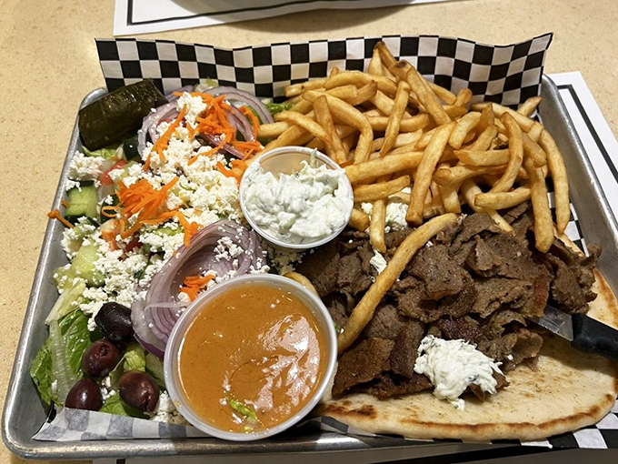 This isn't just a gyro platter&mdash;it's a Mediterranean vacation on a metal tray. The feta-topped Greek salad plays perfect wingman to seasoned meat.