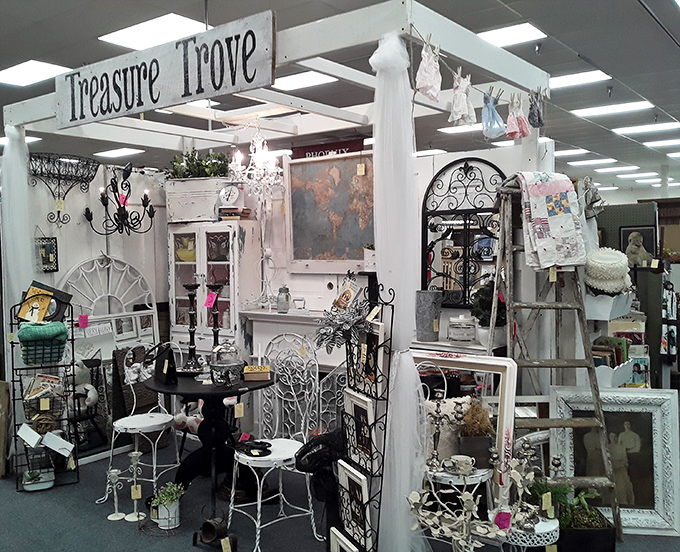 The "Treasure Trove" lives up to its name with a shabby-chic wonderland of white ironwork, vintage frames, and garden-inspired decor.