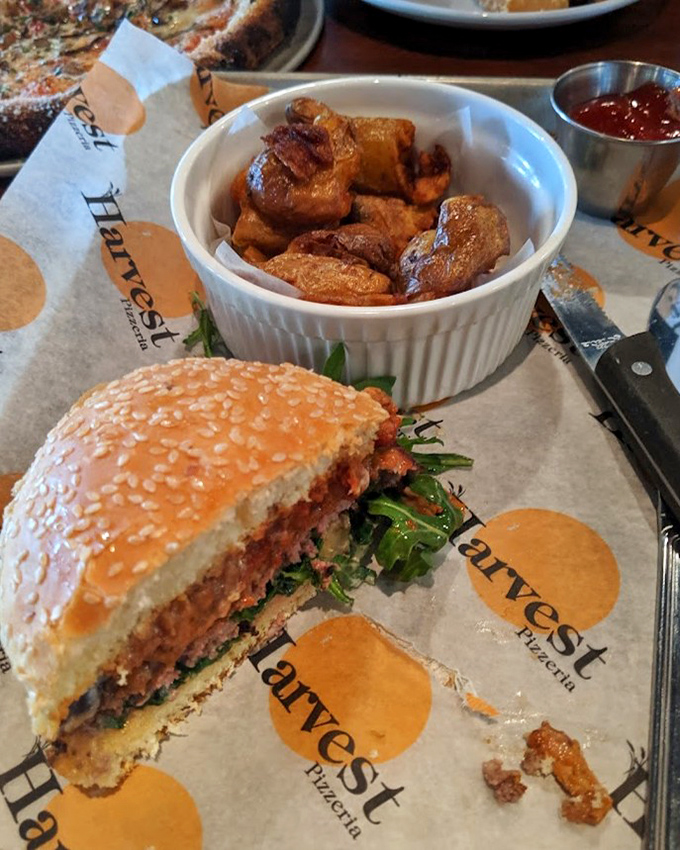 This isn't just a burger; it's a handheld masterpiece of flavor architecture, complete with crispy potatoes that deserve their own fan club.