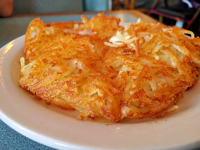 Hash browns that achieve the impossible trifecta: crispy exterior, tender interior, and enough surface area to properly soak up egg yolk. Engineering at its most delicious.